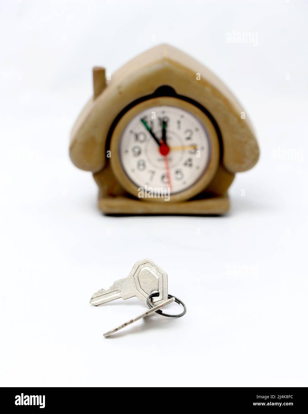picture of a keys in front of vintage alarm clock Stock Photo - Alamy