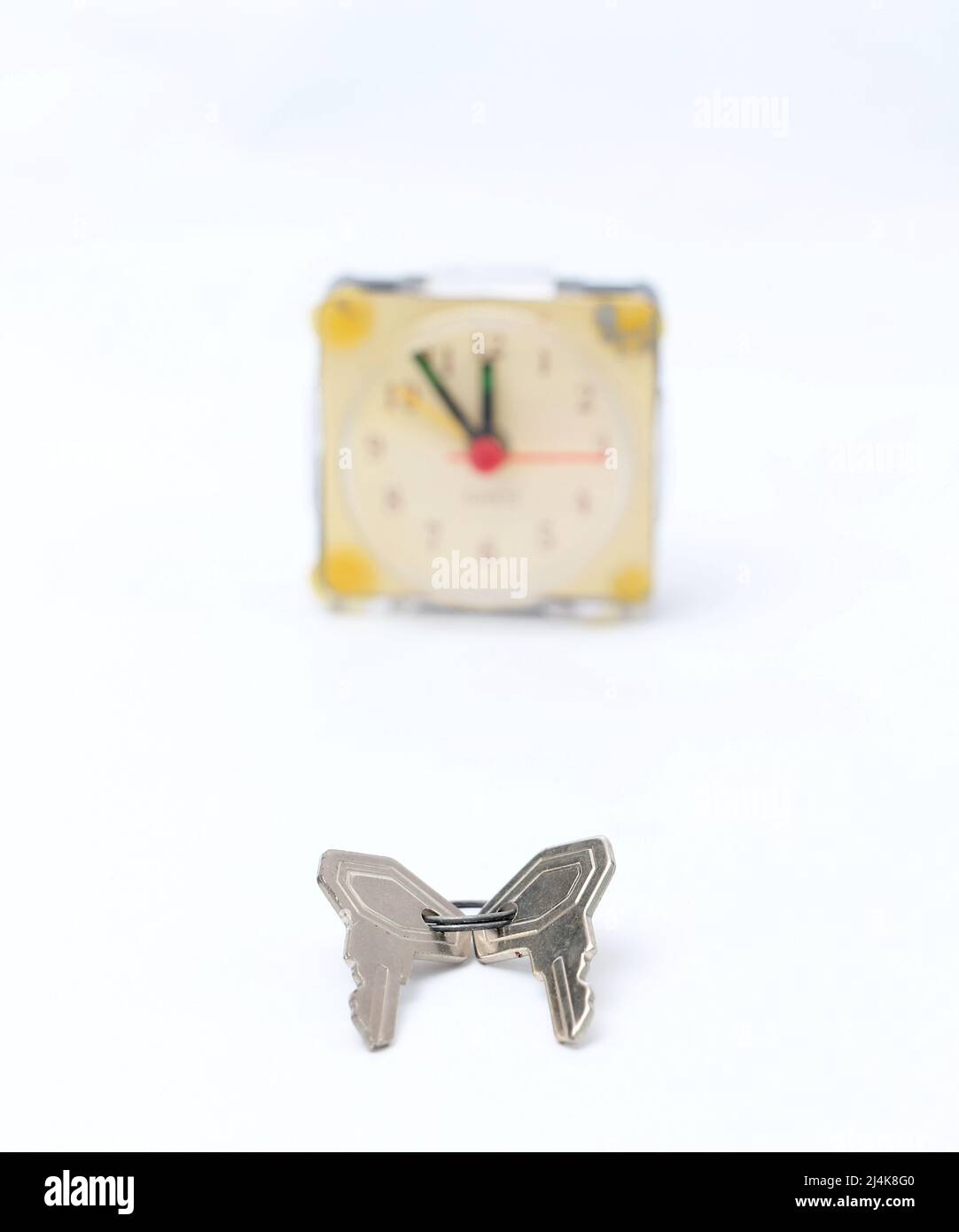 picture of a keys in front of vintage alarm clock Stock Photo - Alamy