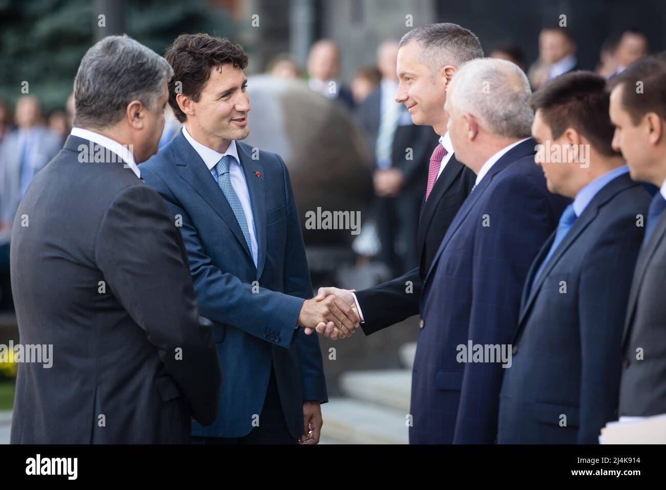 Prime Minister of Canada Justin Trudeau shake hands with one of the ...