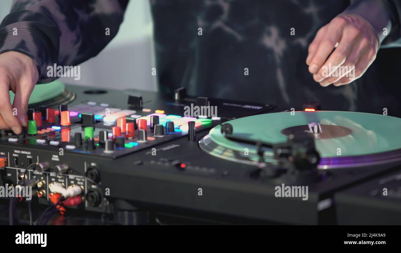 Click colored squares on mixer panel. ART. Hands in dark room are ...