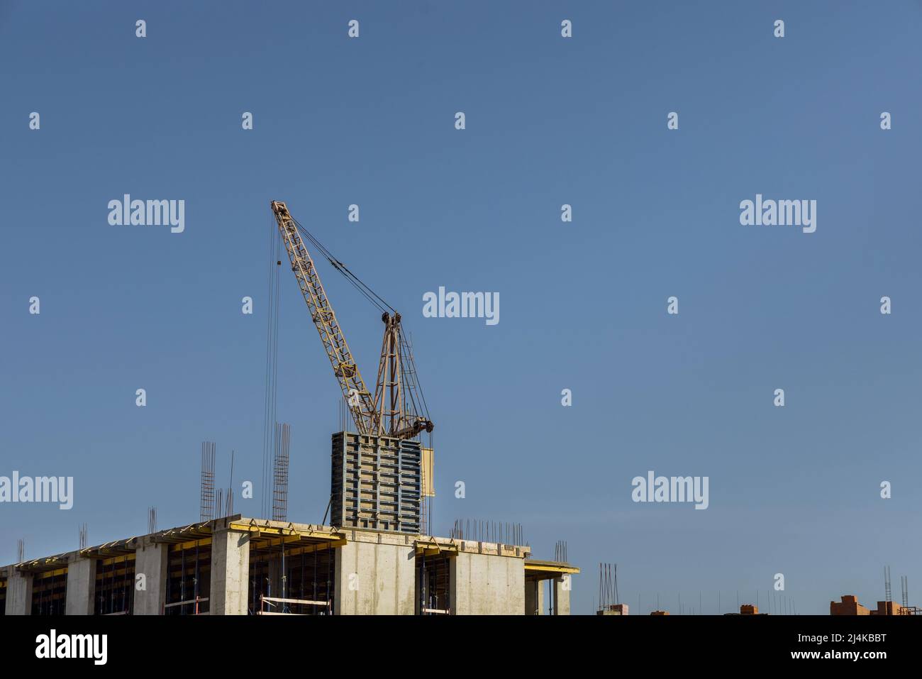 Tower cranes near high rise building with concrete building Stock Photo ...