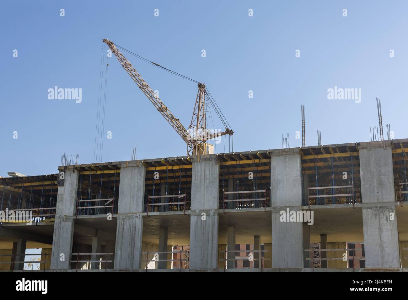 Building of high-rise apartment in the under construction site with a ...
