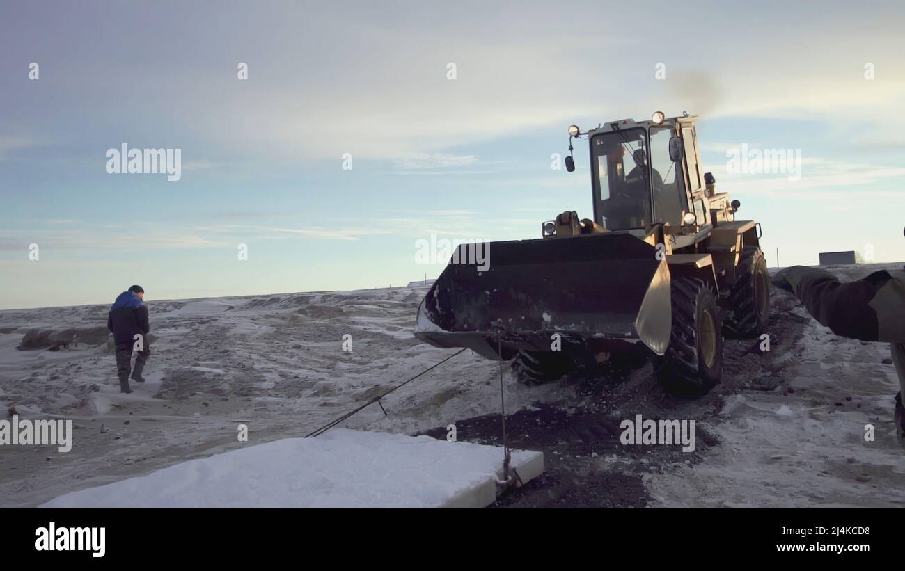 Big tractor at the north pole. CLIP. In the foreground, a tractor is ...