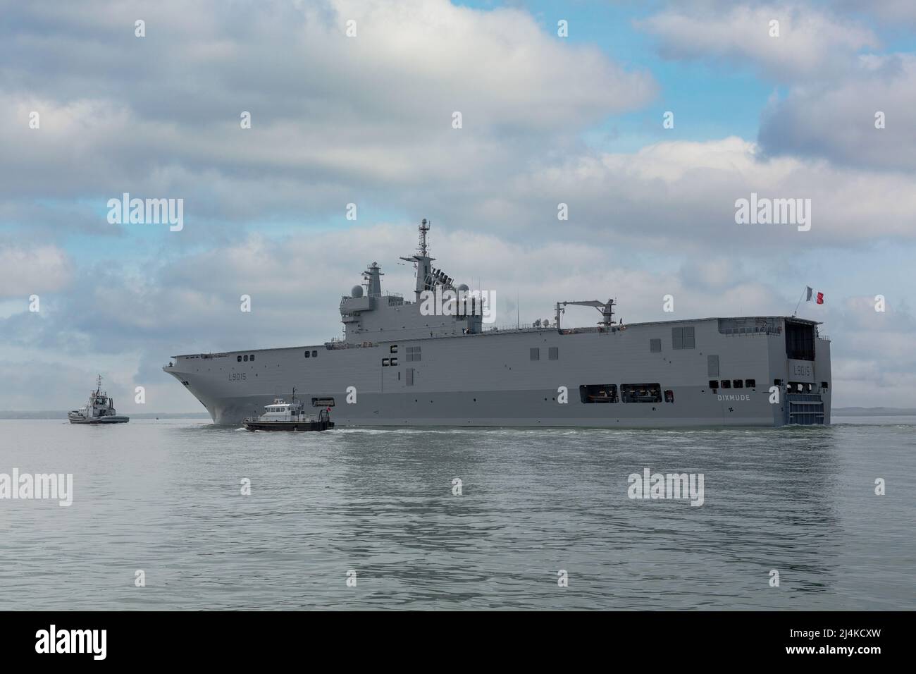 French Naval assault ship Dixmude leaving Portsmouth. View of the port ...