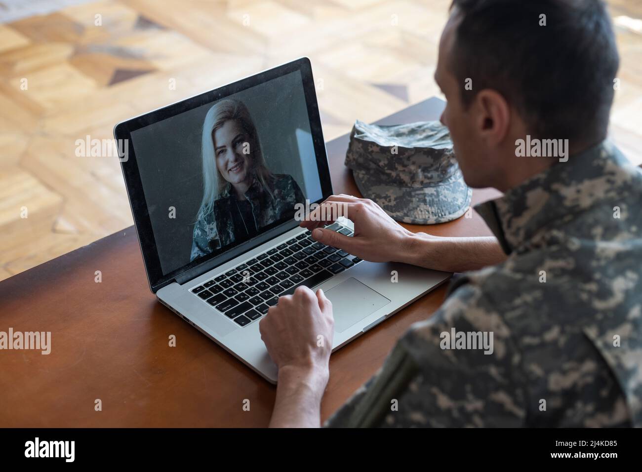 Soldier works on his laptop Stock Photo - Alamy