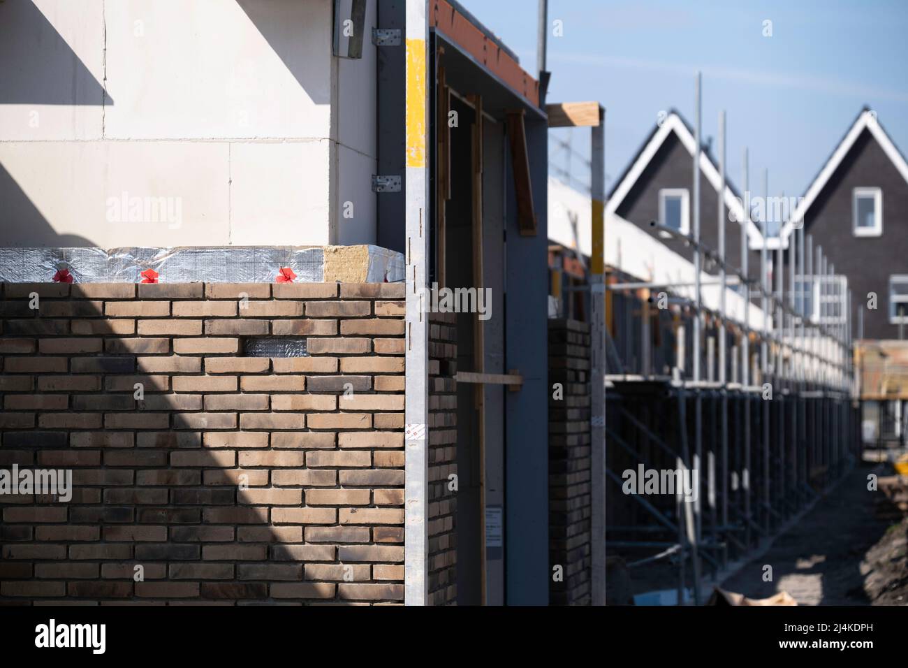 Construction site with houses under construction. In the foreground ...
