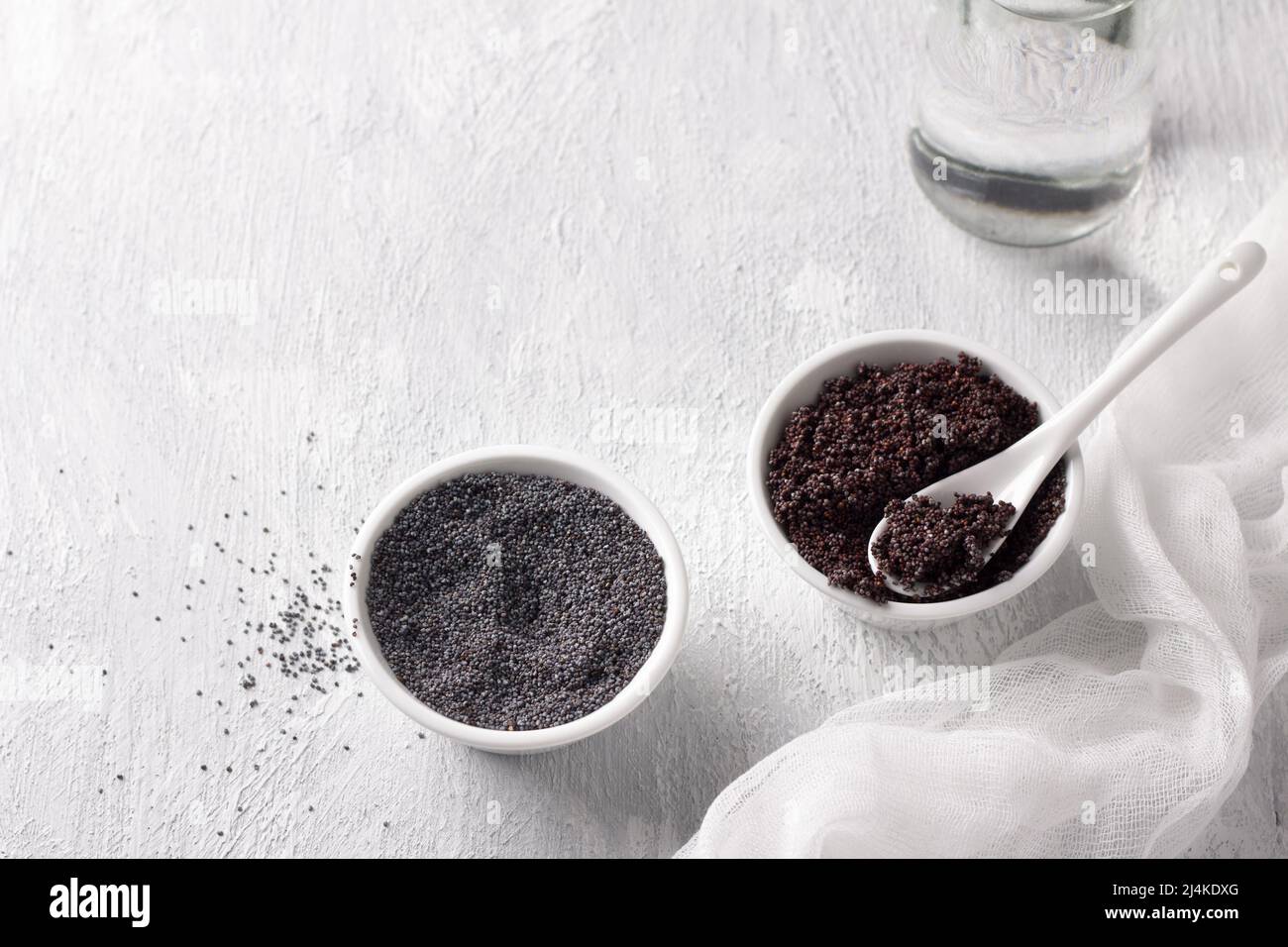 Ingredients for poppy milk. poppy seeds dry and soaked, water in bottle ...