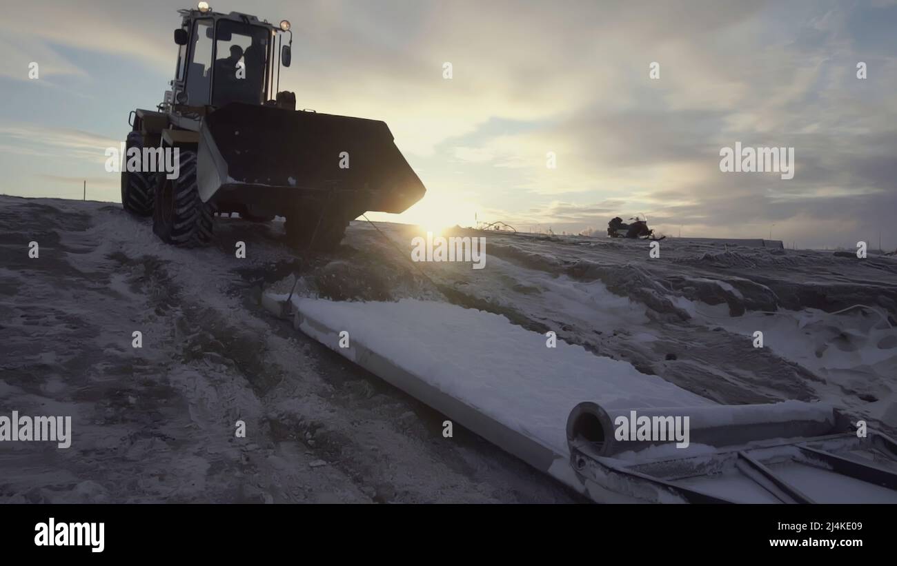 Big tractor at the north pole. CLIP. In the foreground, a tractor is ...