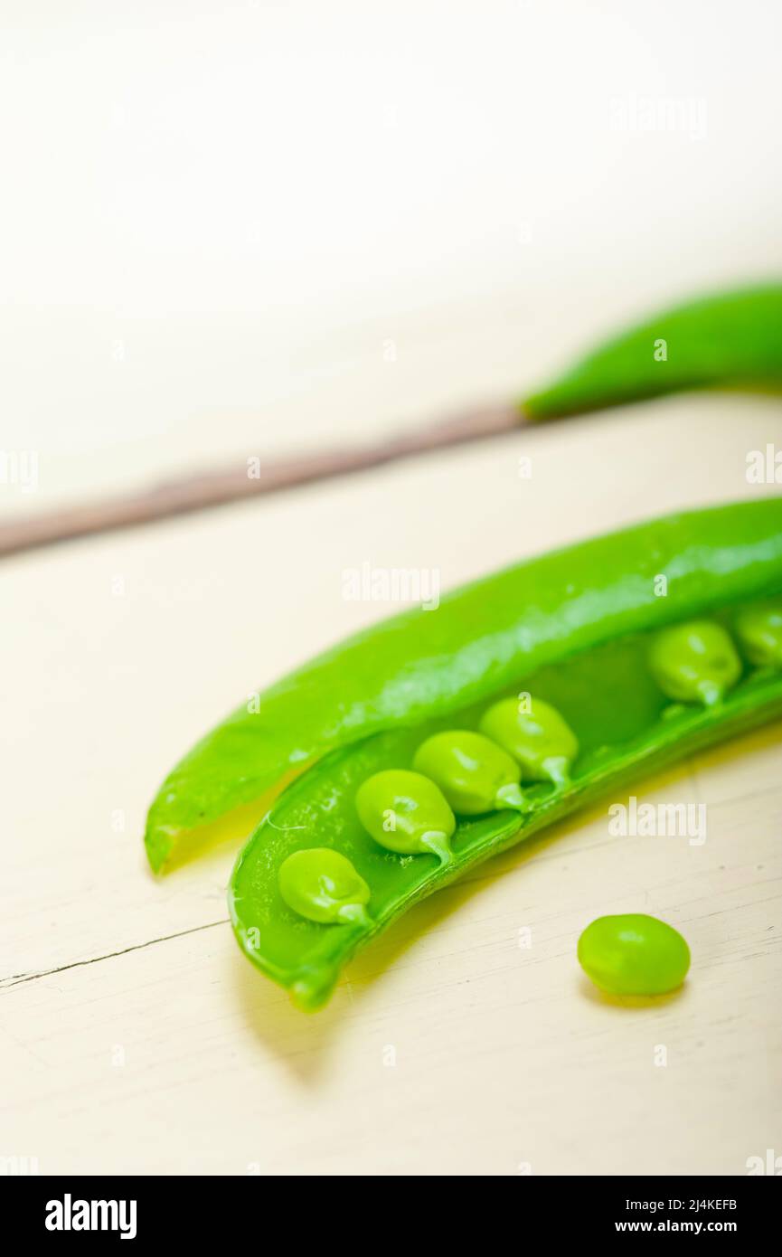 hearthy fresh green peas over a rustic wood table Stock Photo - Alamy