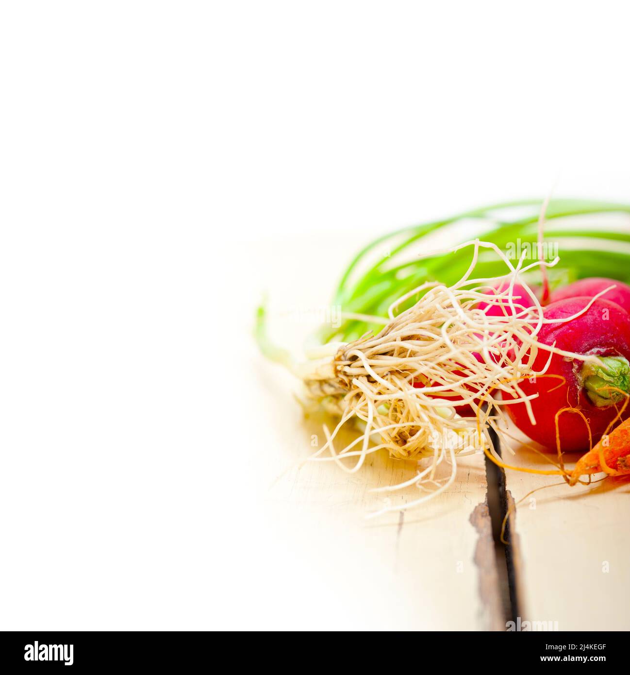 raw root vegetable on a rustic white wood table Stock Photo - Alamy