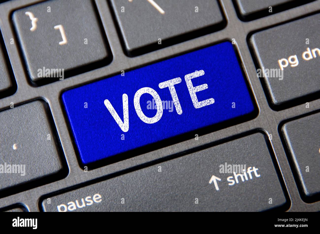Online voting concept - Laptop keyboard with blue Vote button Stock ...