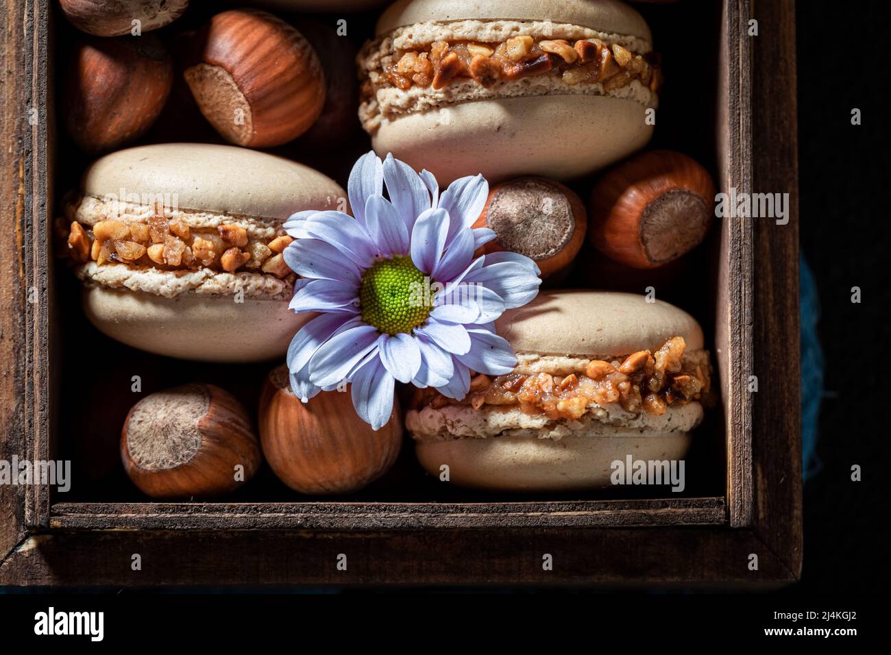Delicious and fresh nuts macaroons in small wooden box. Sweet macaroons ...