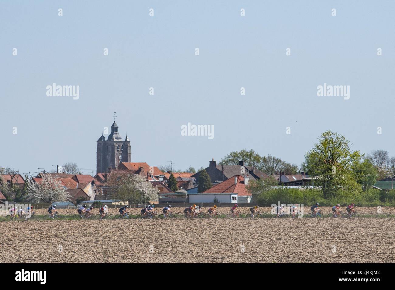 The peloton on the Mons-en-Pévèle secteur of cobbles in Paris-Roubaix ...