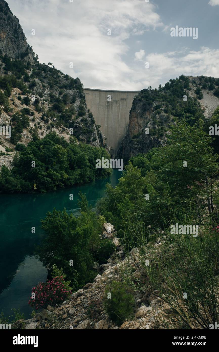 Panoramic view of dam habitat and river with emerald azure water ...