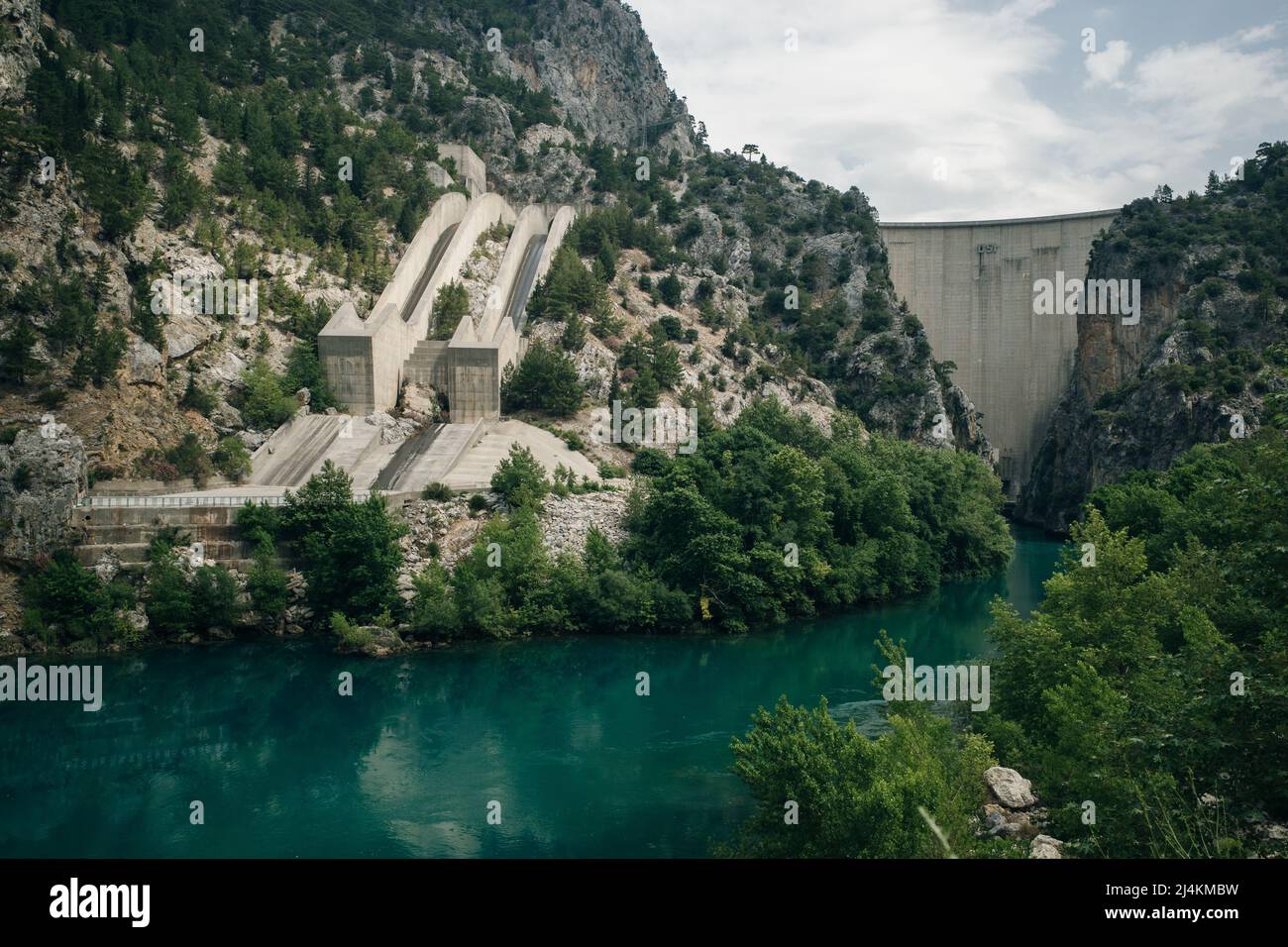Panoramic view of dam habitat and river with emerald azure water ...
