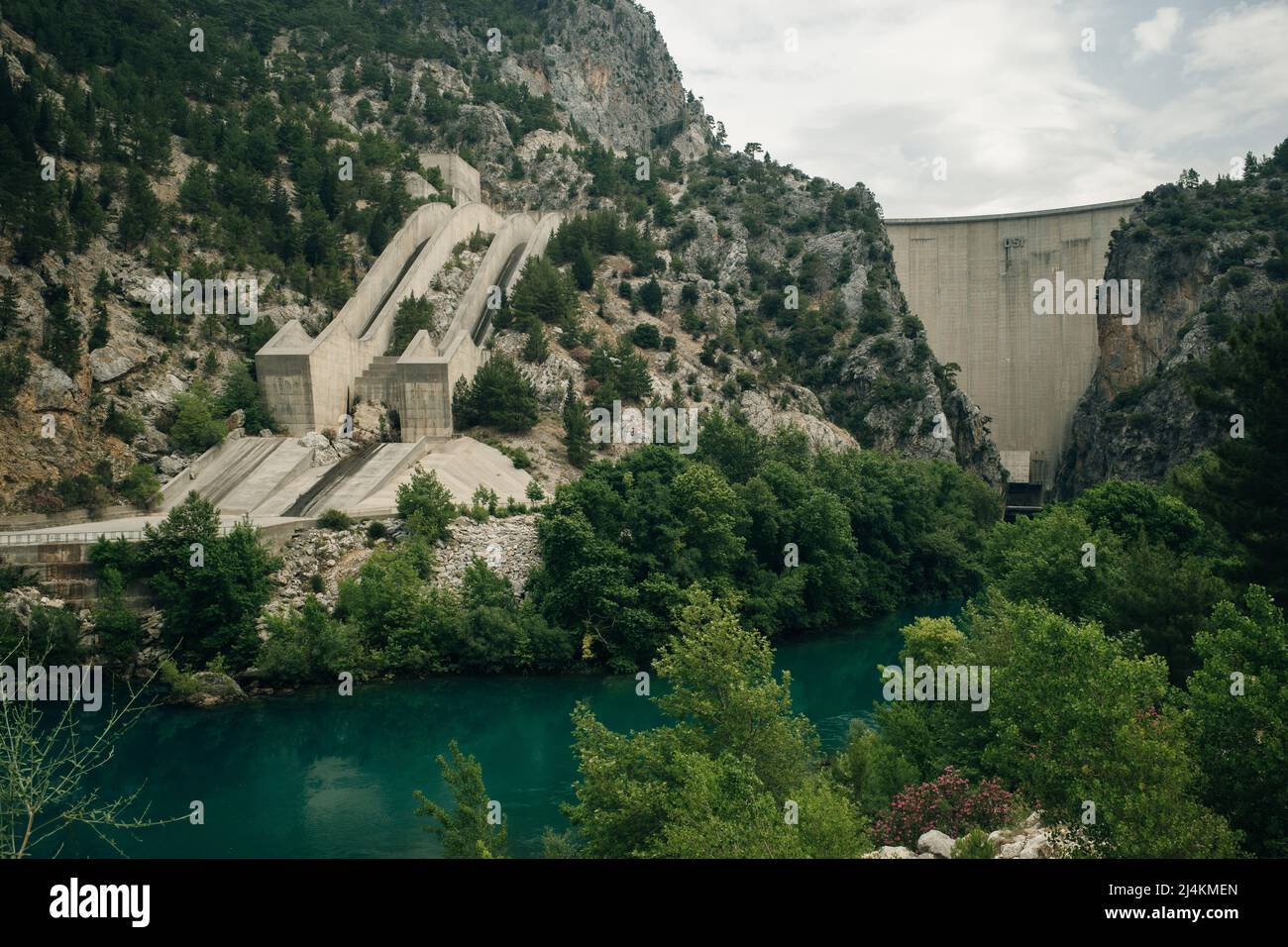 Panoramic view of dam habitat and river with emerald azure water ...