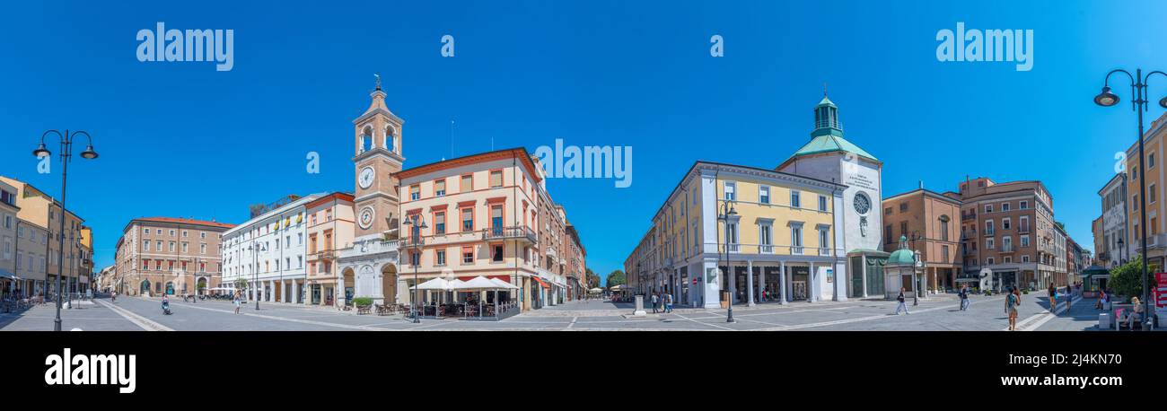 Rimini, Italy, September 2, 2021: people are passing a clock tower on ...