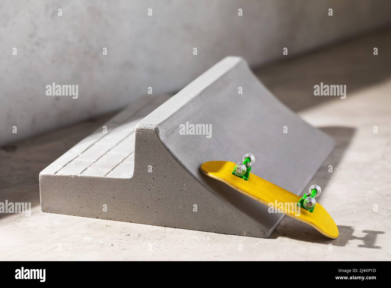 Fingerboard and plaster ramp on an abstract background Stock Photo - Alamy