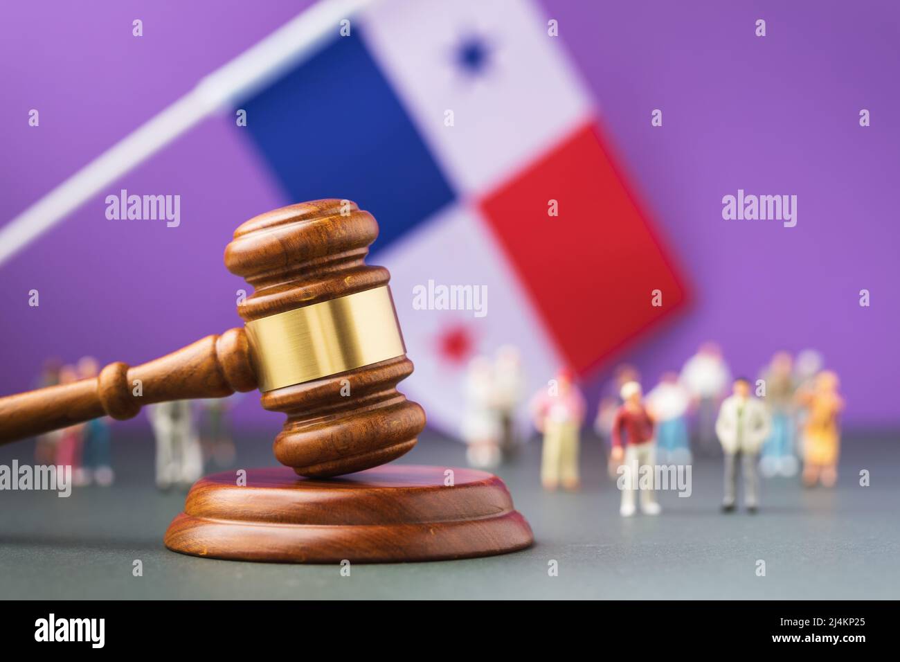 Judge gavel with blurred Panama flag and plastic toy men background ...