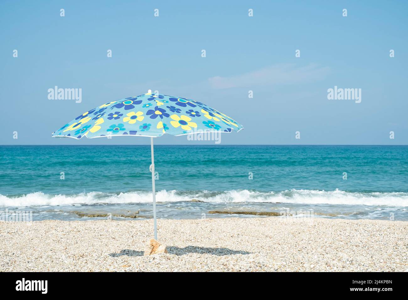 Beach umbrella on the beach Stock Photo - Alamy