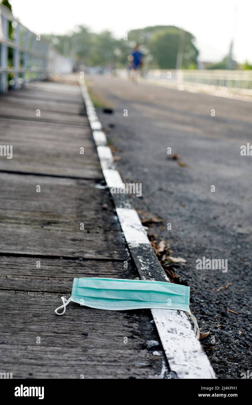 Medical face mask on the pedestrian bridge in the side of street ...