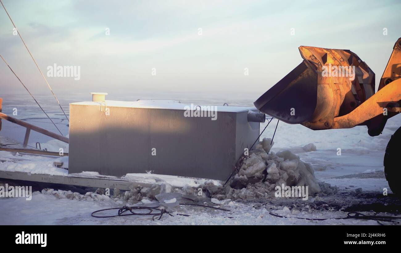 Big tractor at the north pole. CLIP. In the foreground, a tractor is ...