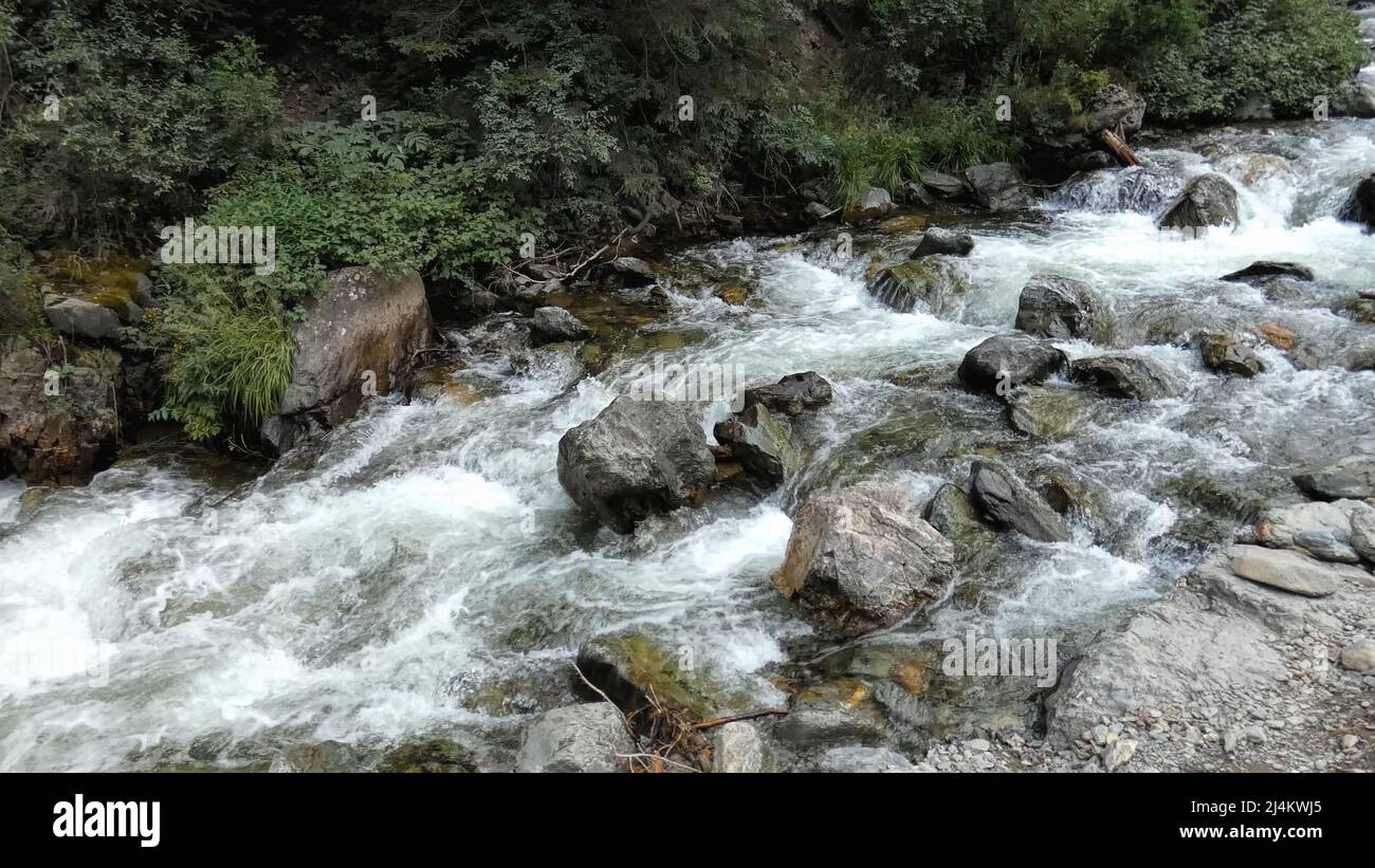 Stream flowing among stones hi-res stock photography and images - Alamy
