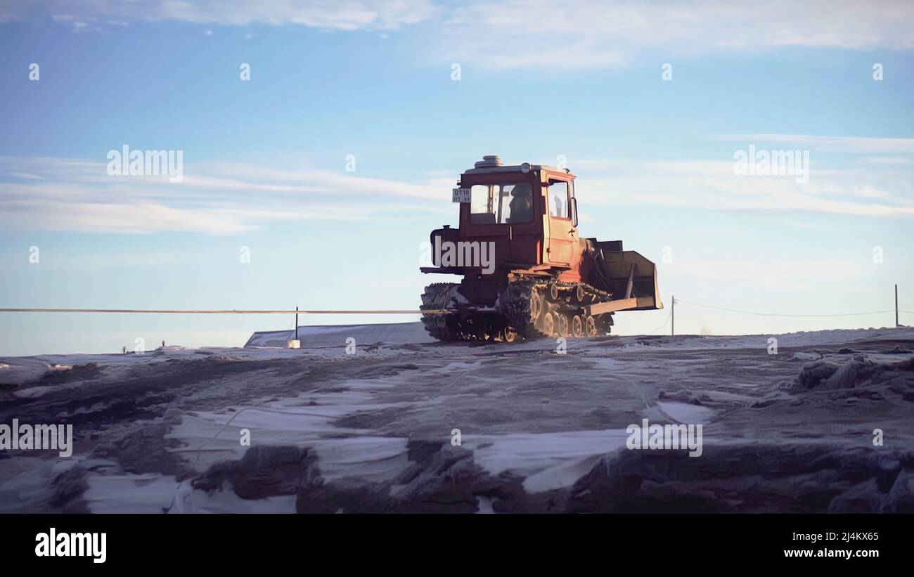 Big tractor at the north pole. CLIP. In the foreground, a tractor is ...