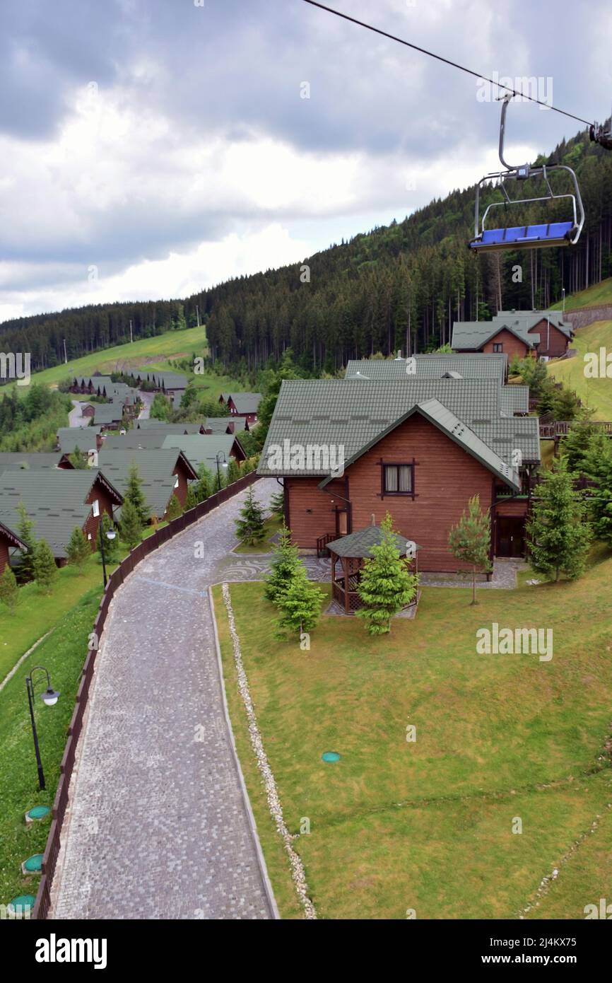 Above the buildings of the hotels of the ski resort in the summer ...