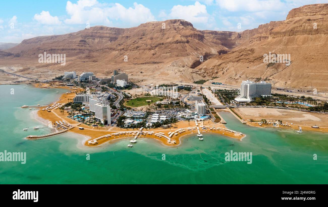 Dead sea beach shore tourist hotels, salt water, daylight Ein Bokek Panorama aerial view Stock ...