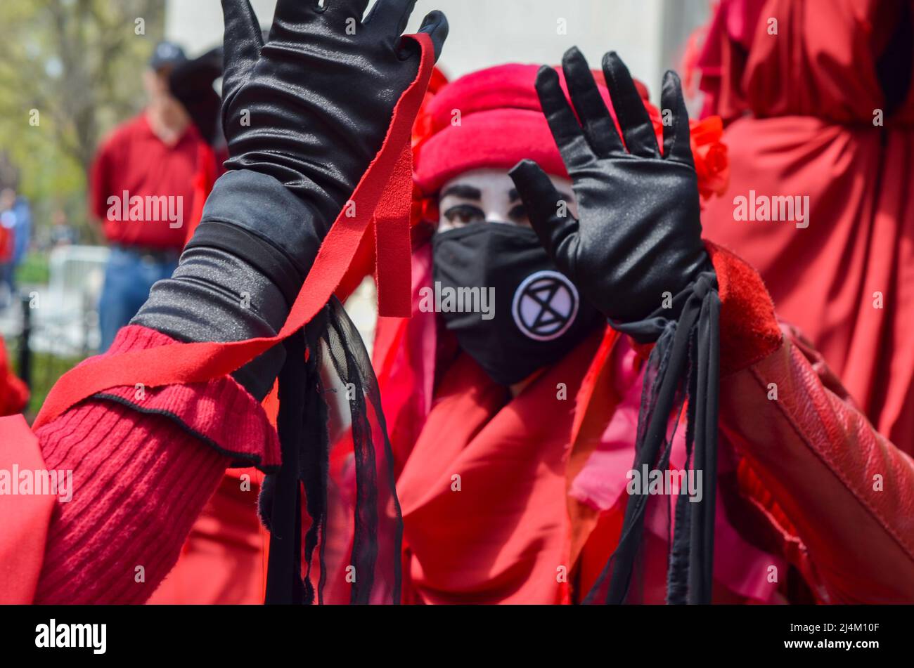 Activists of the Extinction Rebellion group wearing all red to alert ...