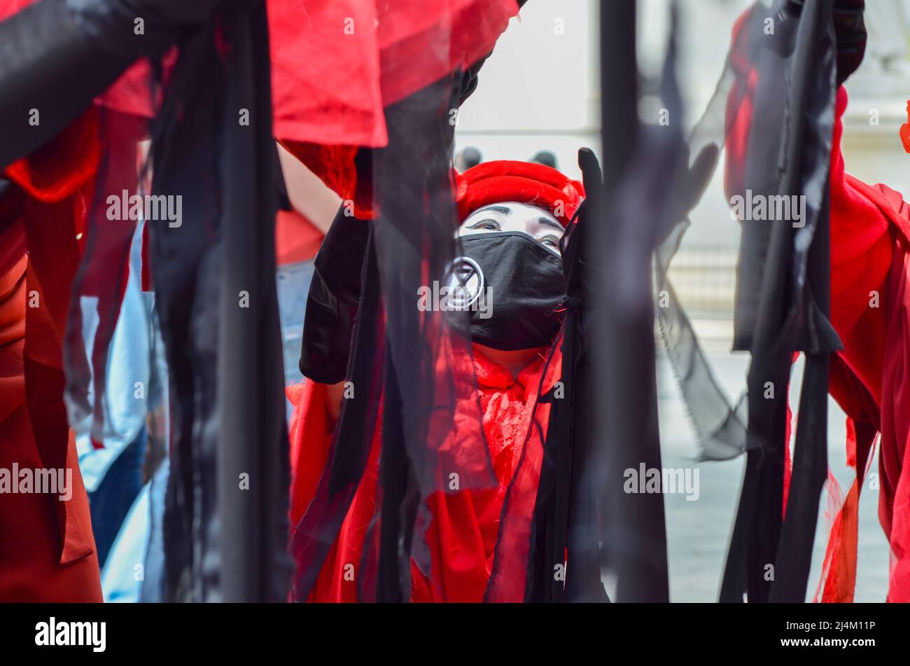 Activists of the Extinction Rebellion group wearing all red to alert ...