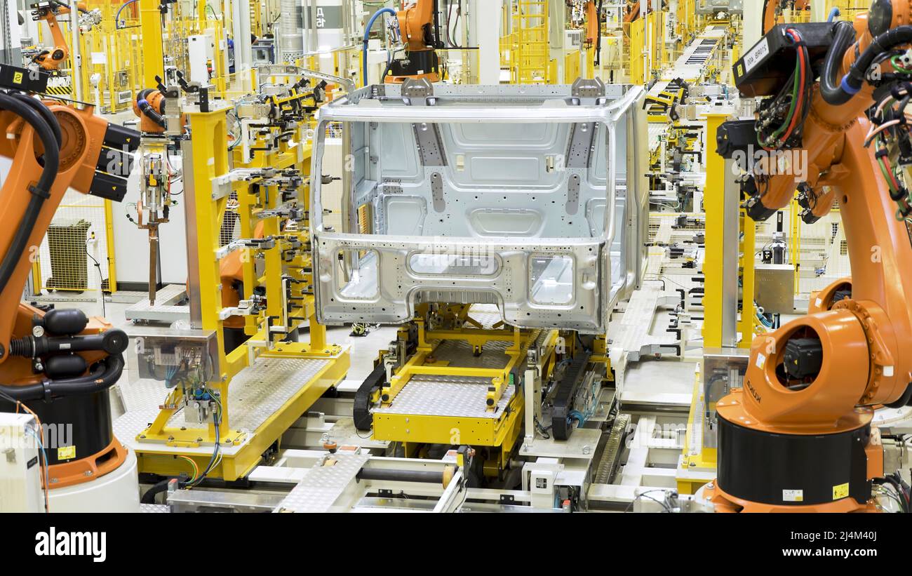 New automated machinery at production factory. Scene. Robotic machines ...