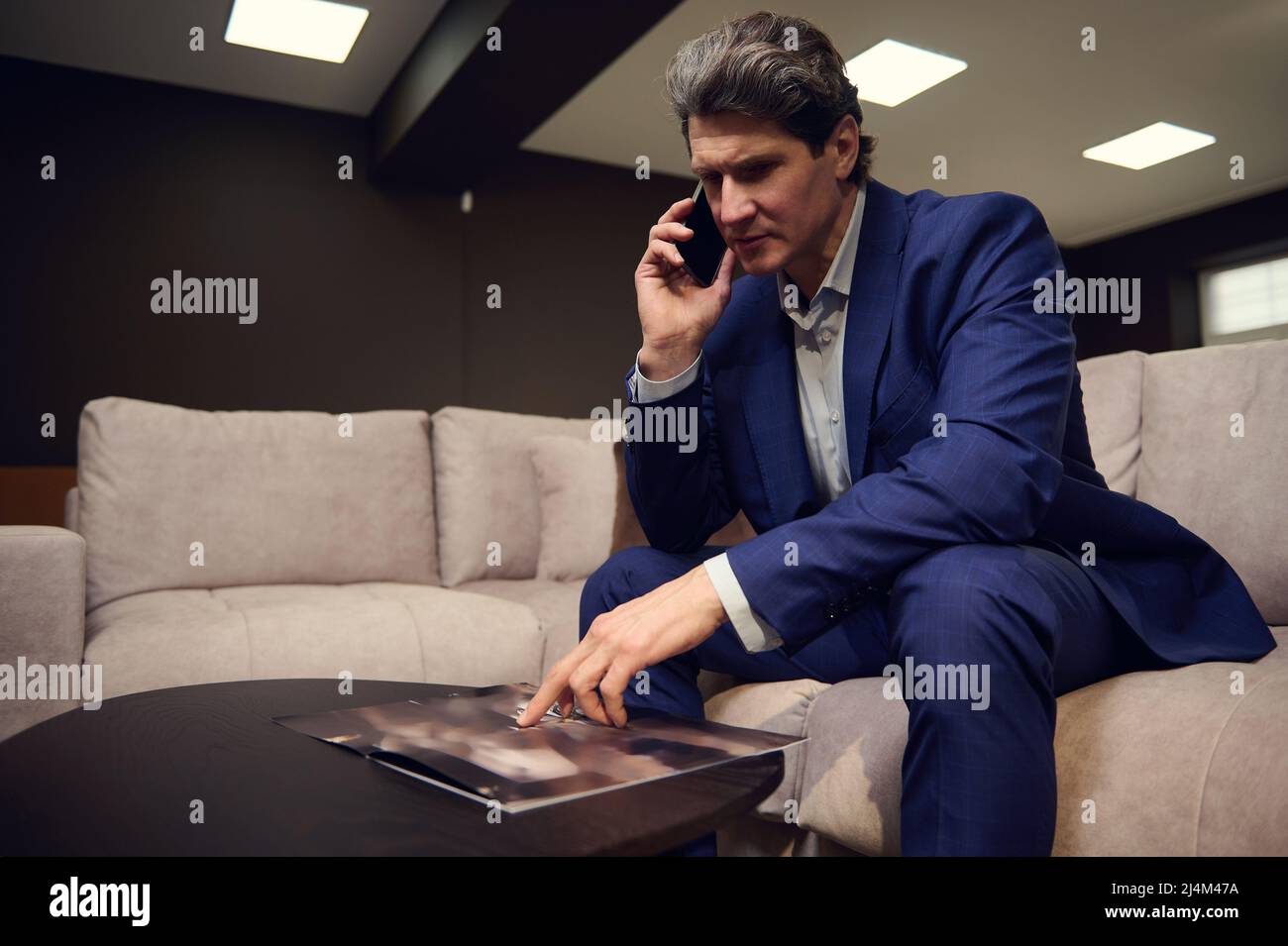 Handsome imposing mature Caucasian man, interior designer, successful ...