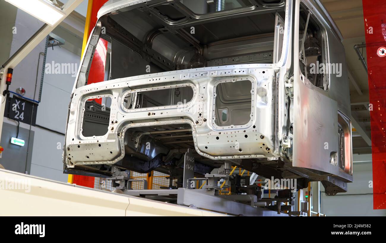 Body of car in production process. Scene. Production of cars at large ...