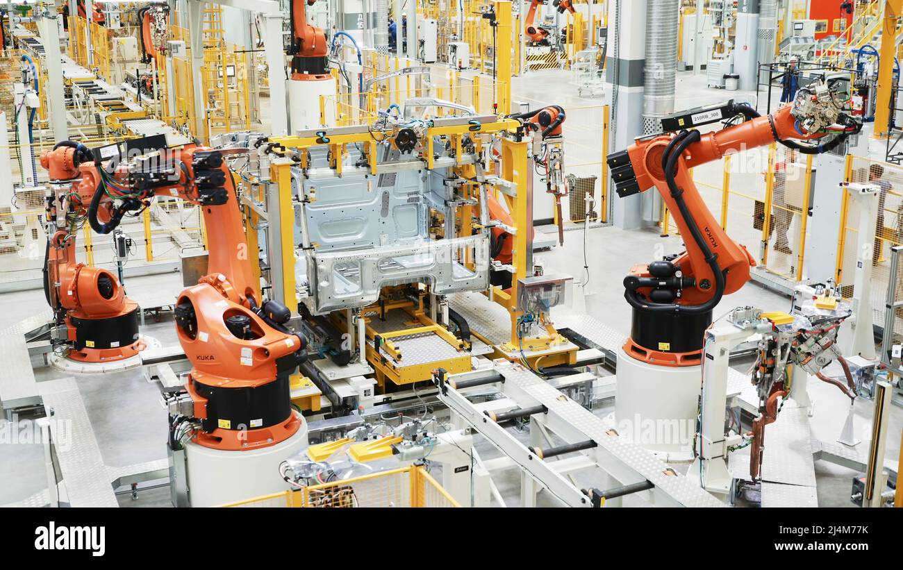 Latest technology in machine production. Scene. Robotic machines ...