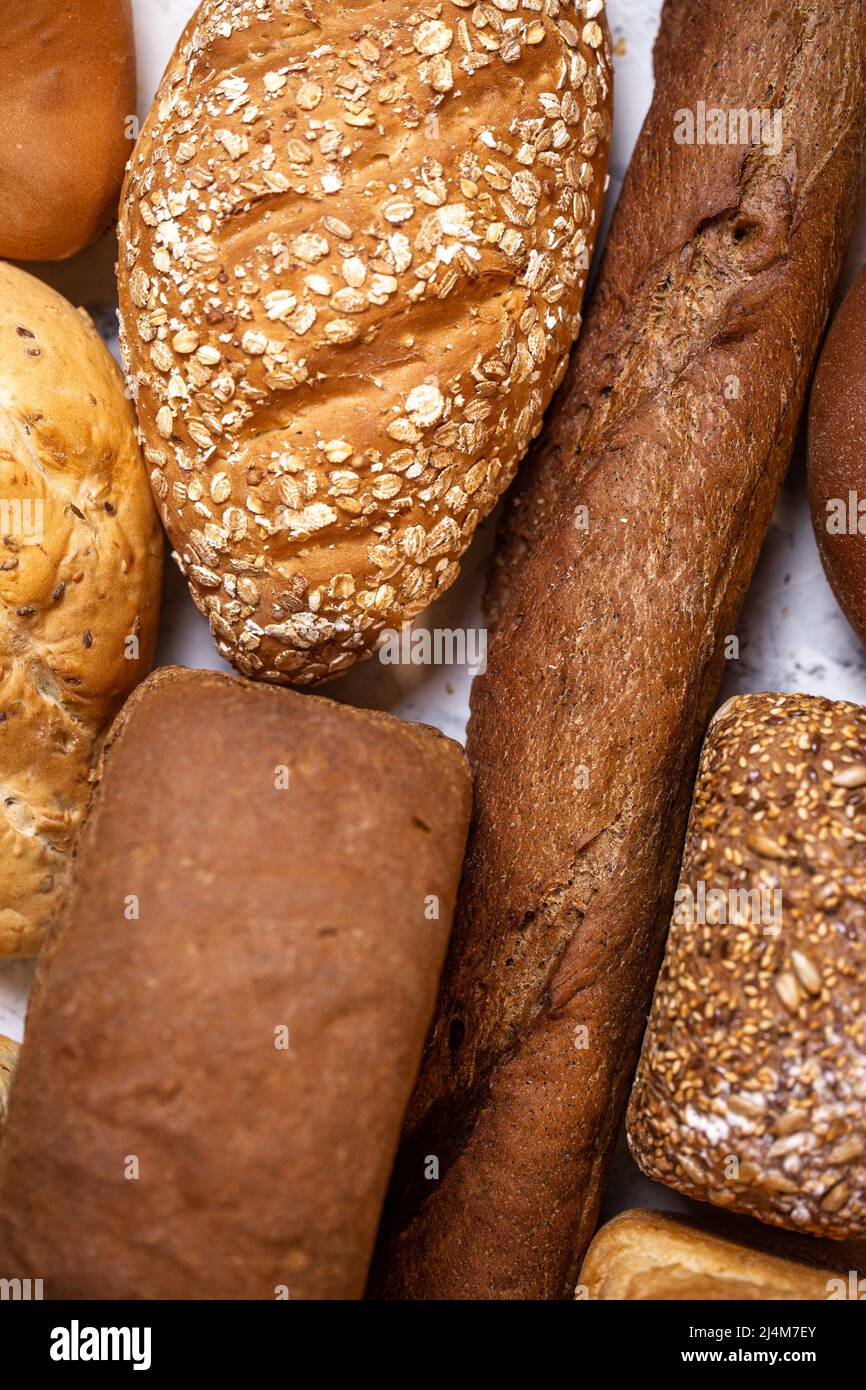 Assortment of different types of bread top view Stock Photo - Alamy