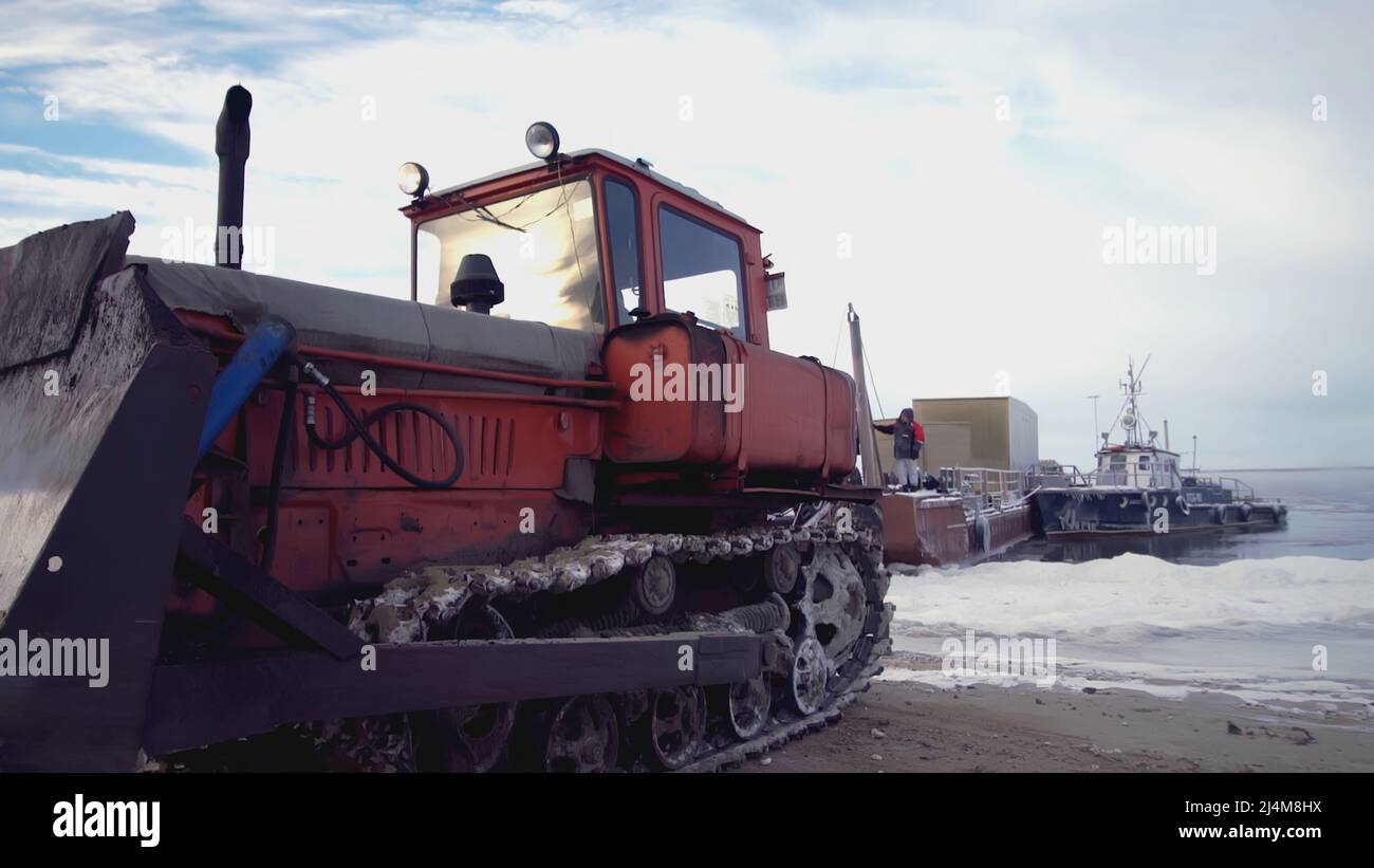 The bulldozer pulls something out with a bucket. CLIP. Close-up on the ...