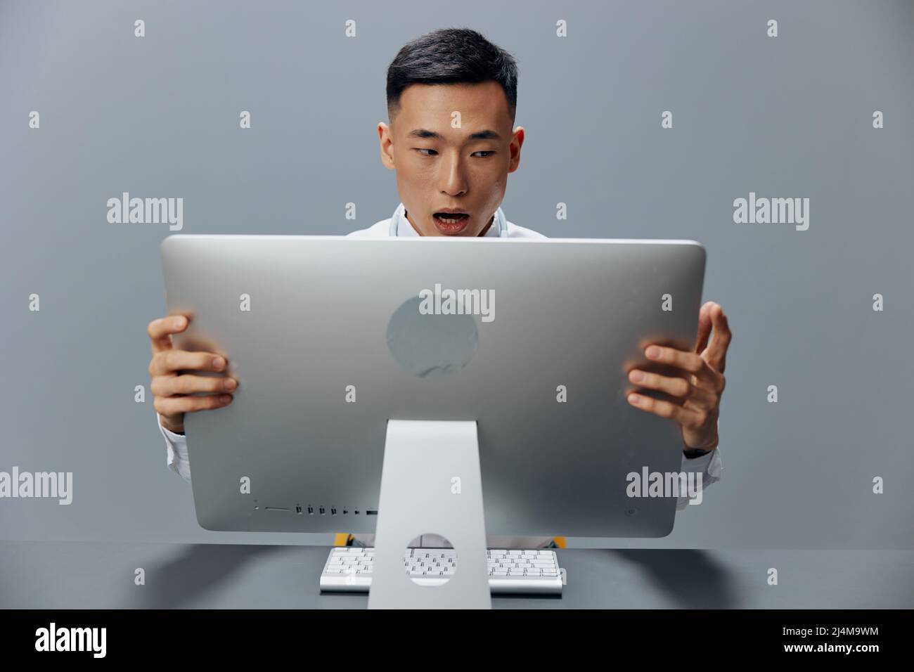 manager holding on to the monitor emotions office Gray background Stock ...