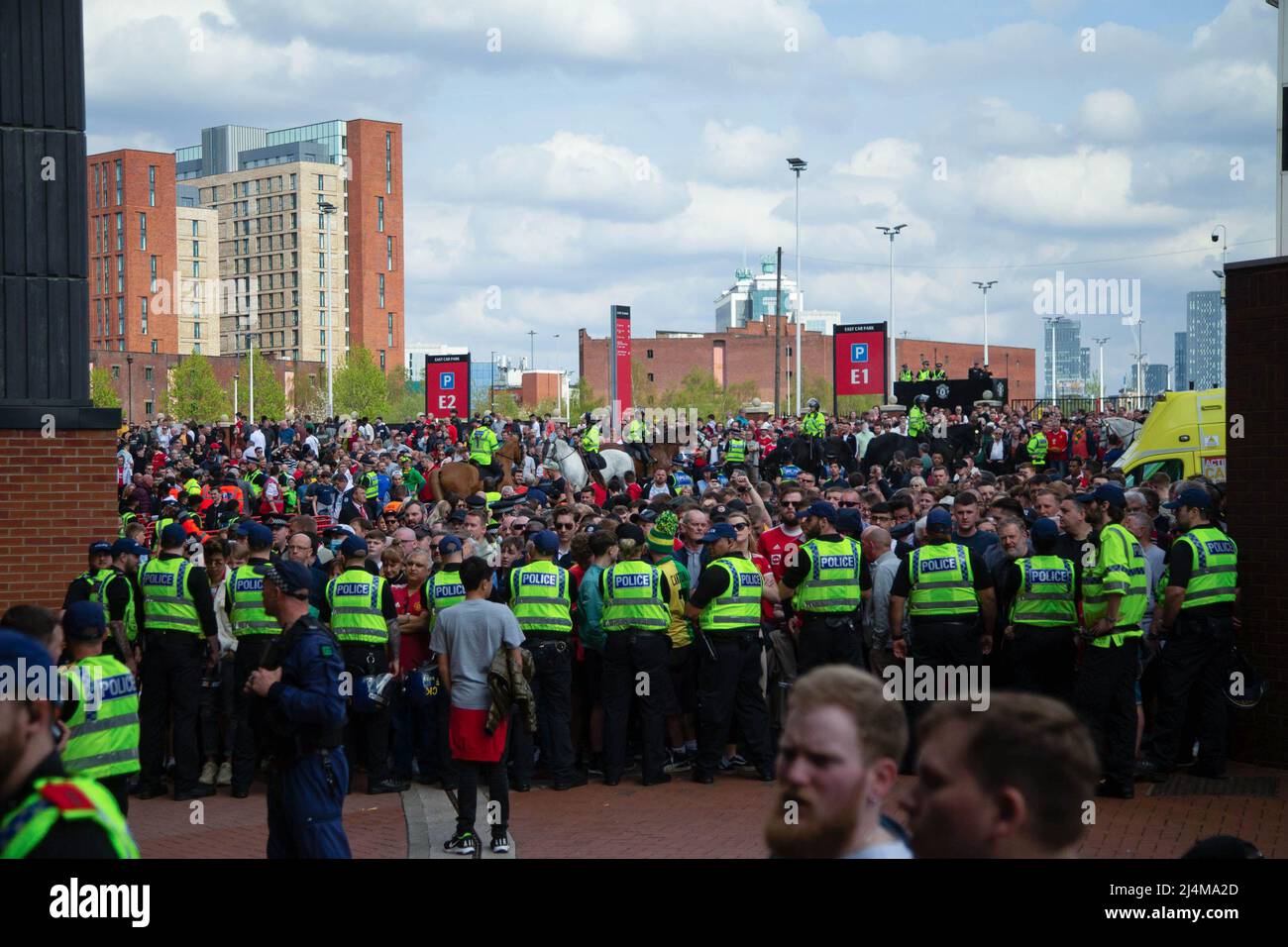 Police officers block fans from accessing the premises during the ...