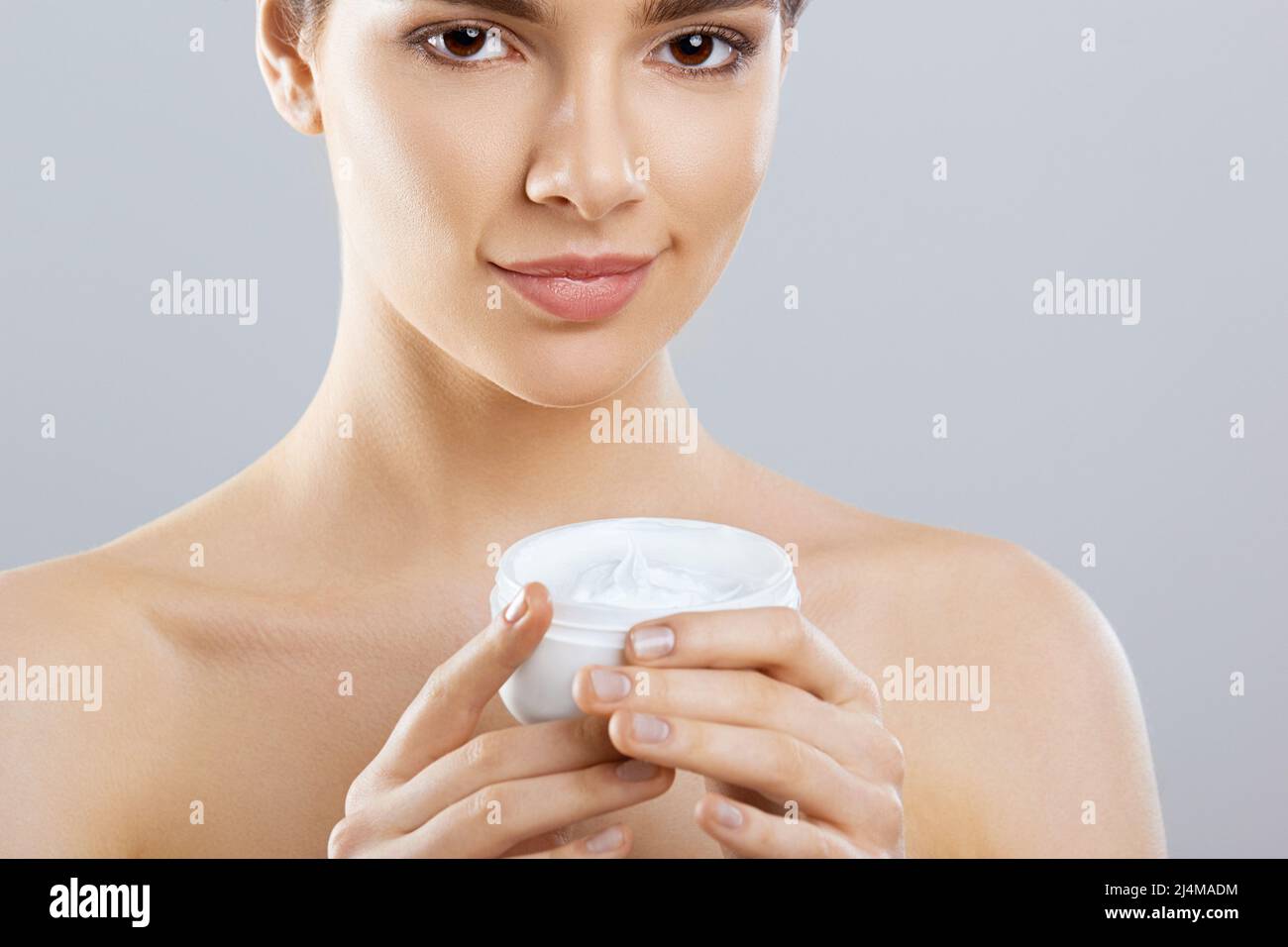 Beautiful Woman With Face Cream. Skin Protection. SkinCare. Spa. A ...