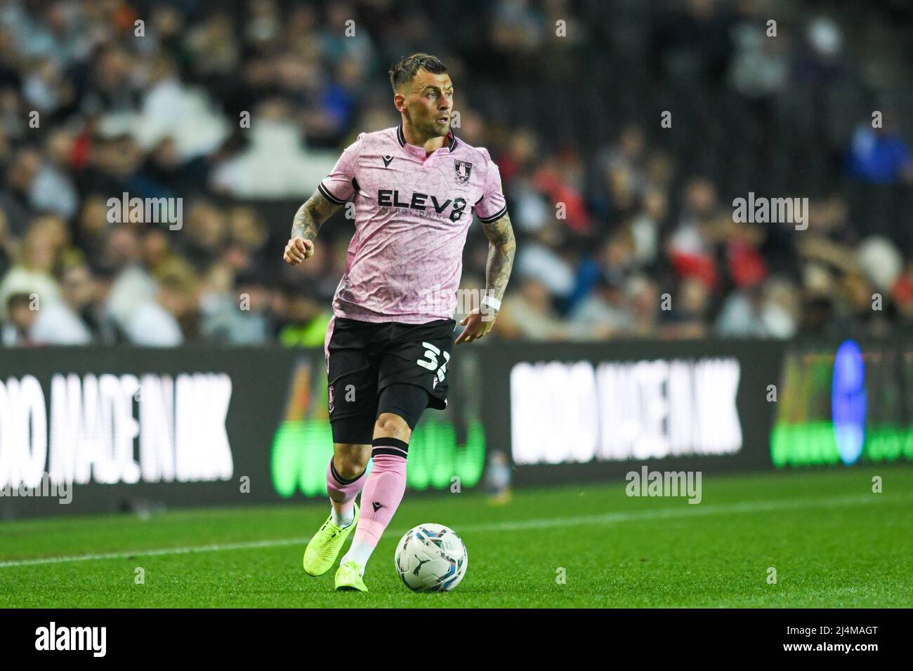 Jack Hunt #32 of Sheffield Wednesday runs down the wing with the ball ...