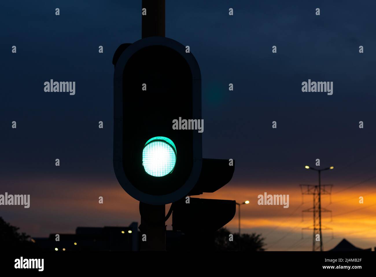 Close up of green traffic light on a South African street at dusk Stock ...