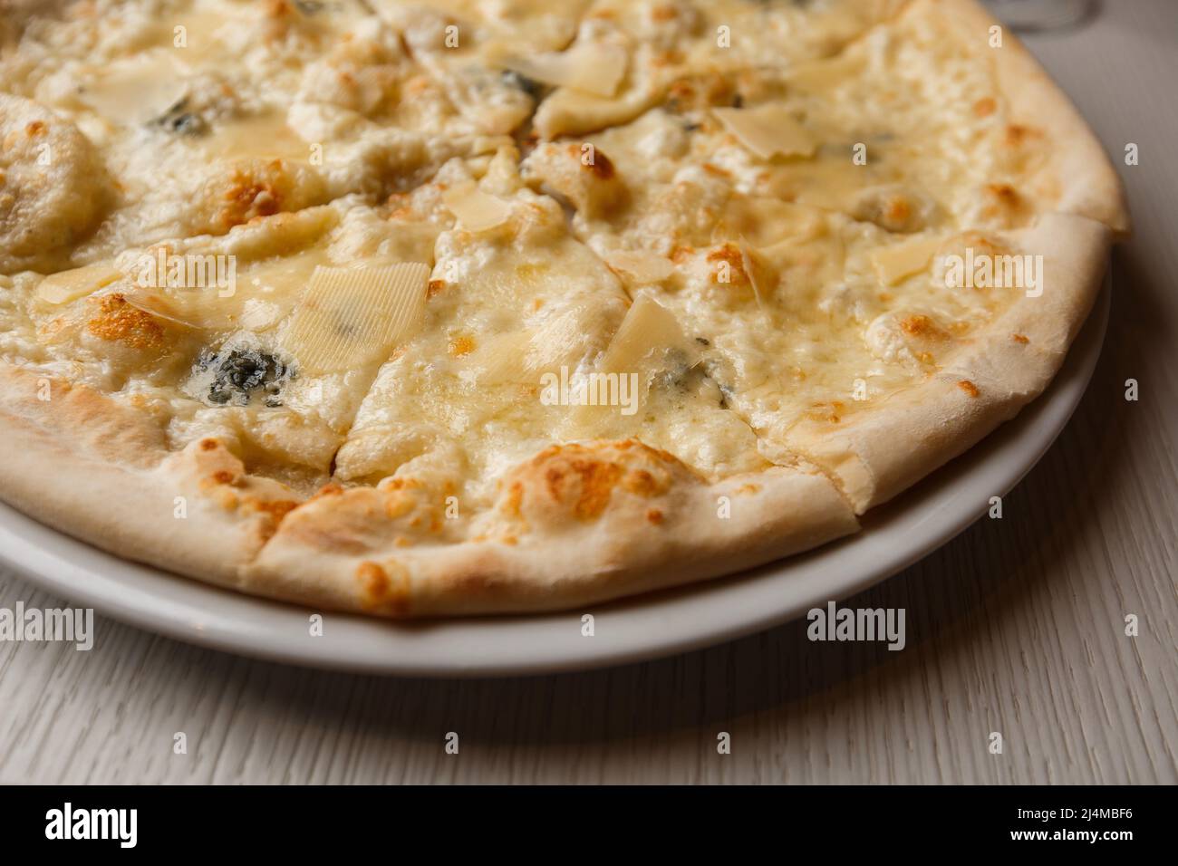 Four cheese pizza quattro formaggi close up photo Stock Photo - Alamy