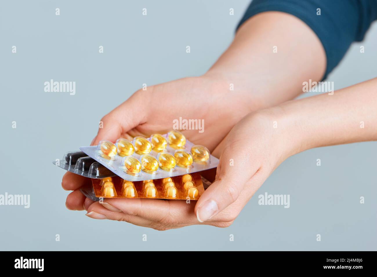 Vitamins And Supplements. Closeup Of Woman Hands Holding Variety Of ...
