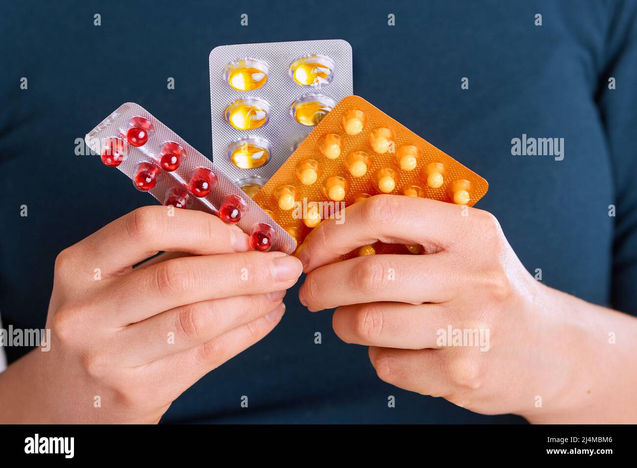 Vitamins And Supplements. Closeup Of Woman Hands Holding Variety Of ...