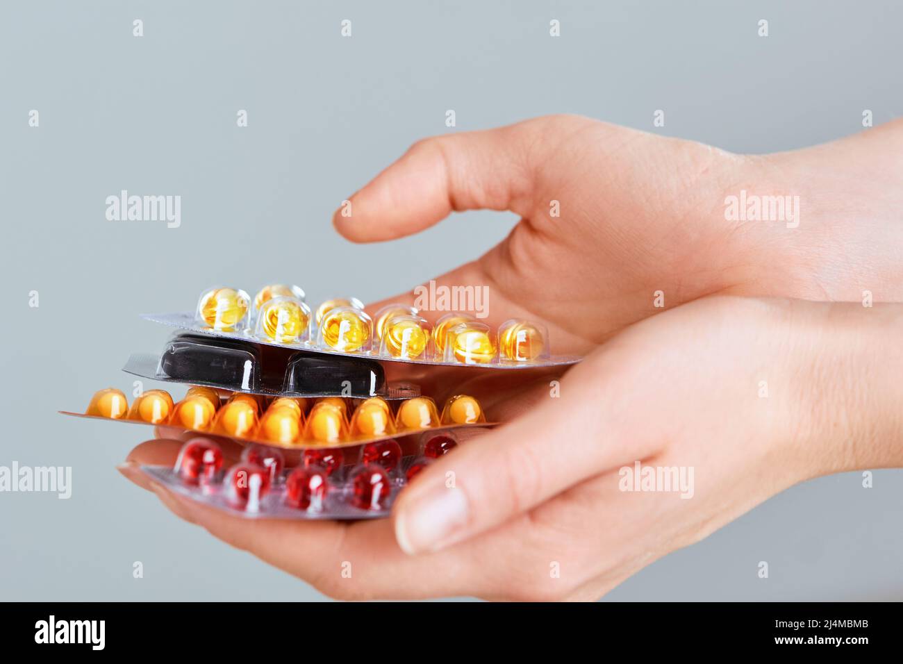 Vitamins And Supplements. Closeup Of Woman Hands Holding Variety Of ...
