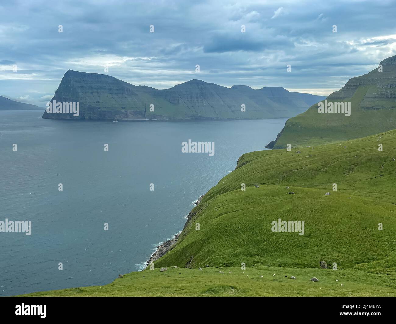 Beautiful aerial view of the Kallur Lighthouse in the Faroe Islands ...