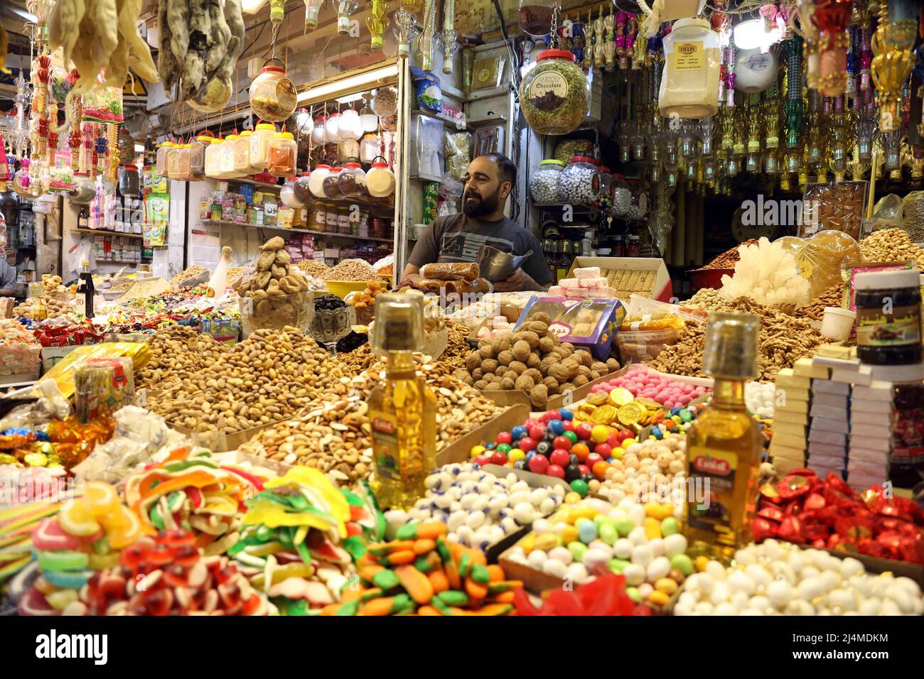 Baghdad, Iraq. 16th Apr, 2022. A shop owner displays his goods during ...