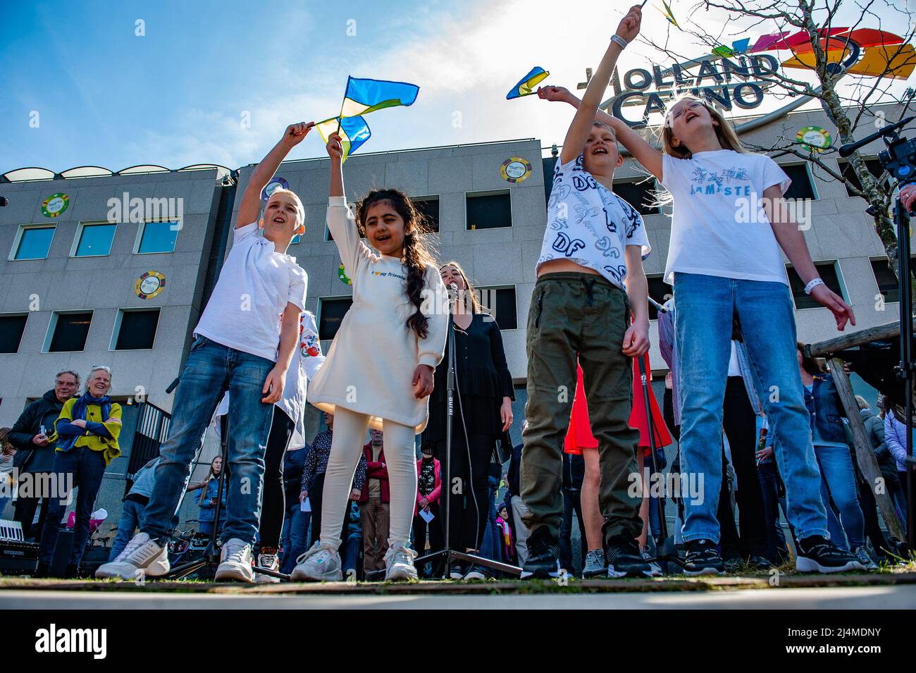 A group of Ukrainian refugees hosted in the city is seen singing a song ...